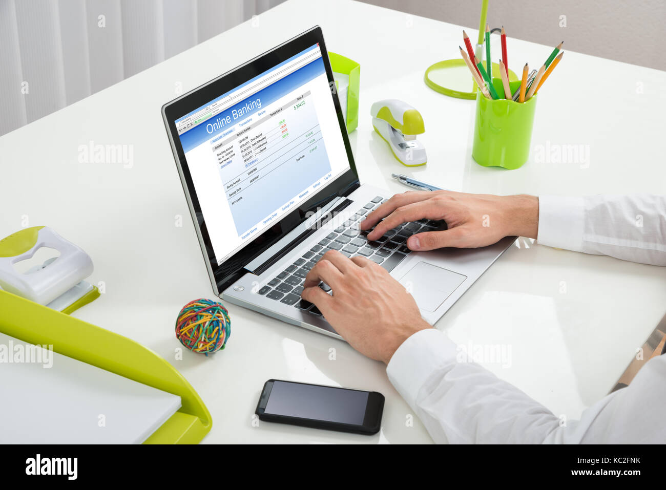 Close-up Of Businessperson Online Banking With Laptop In Office Stock ...