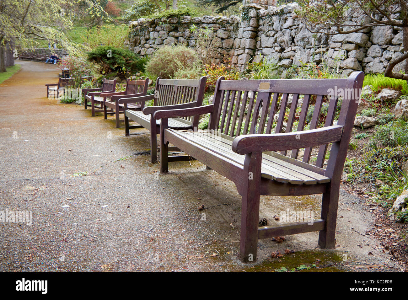 Outdoor wooden bench in a nice mountain area Stock Photo - Alamy