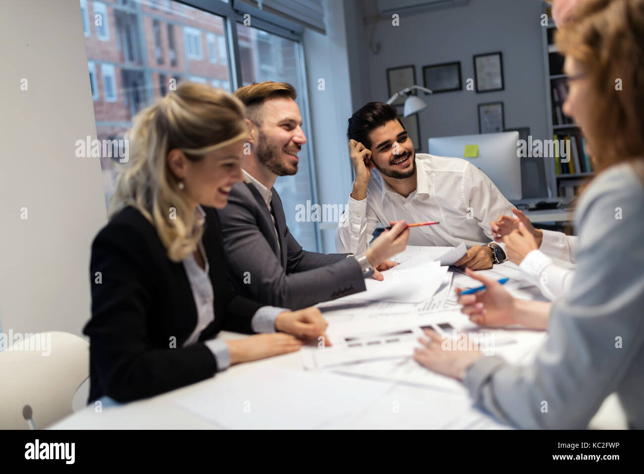 Group of architects working together on project Stock Photo - Alamy