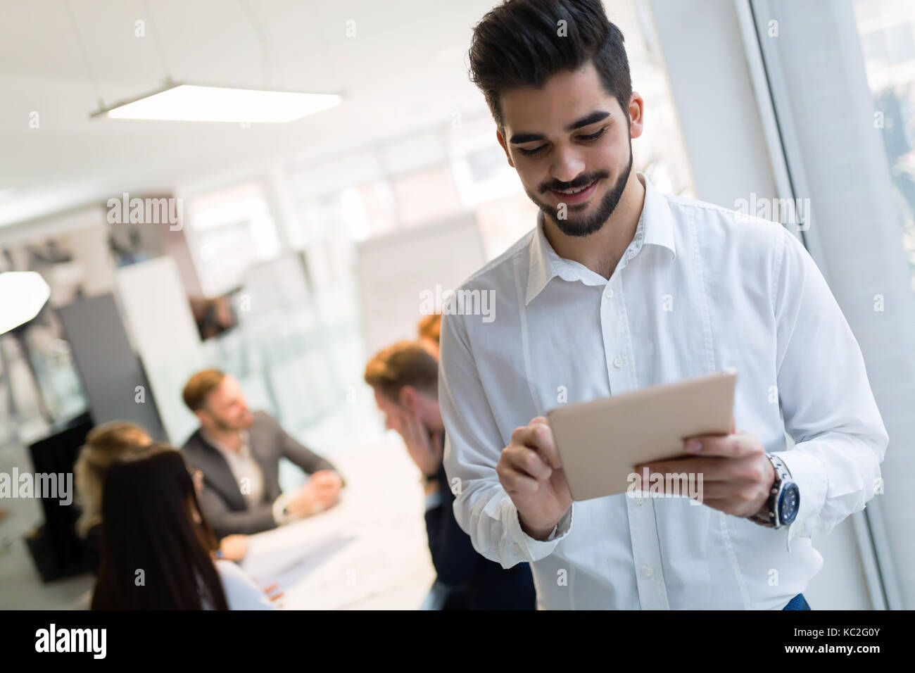 Portrait of young handsome architect on meeting Stock Photo - Alamy