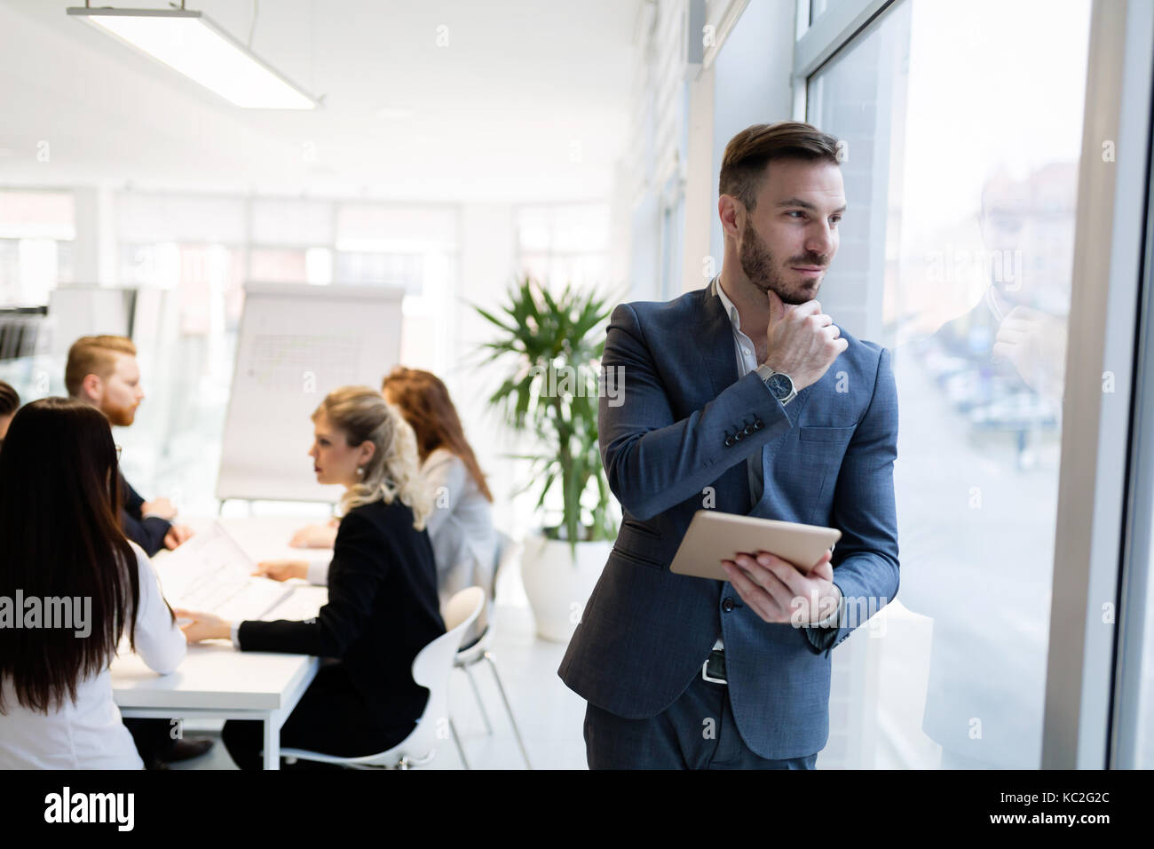 Portrait of young handsome architect on meeting Stock Photo - Alamy