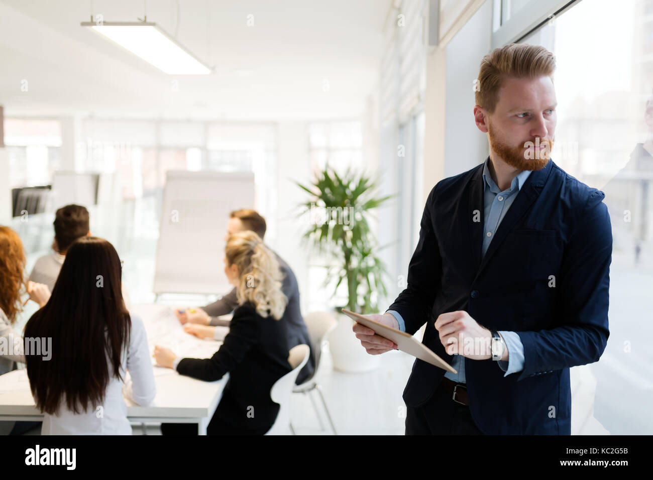 Portrait of young handsome architect on meeting Stock Photo - Alamy