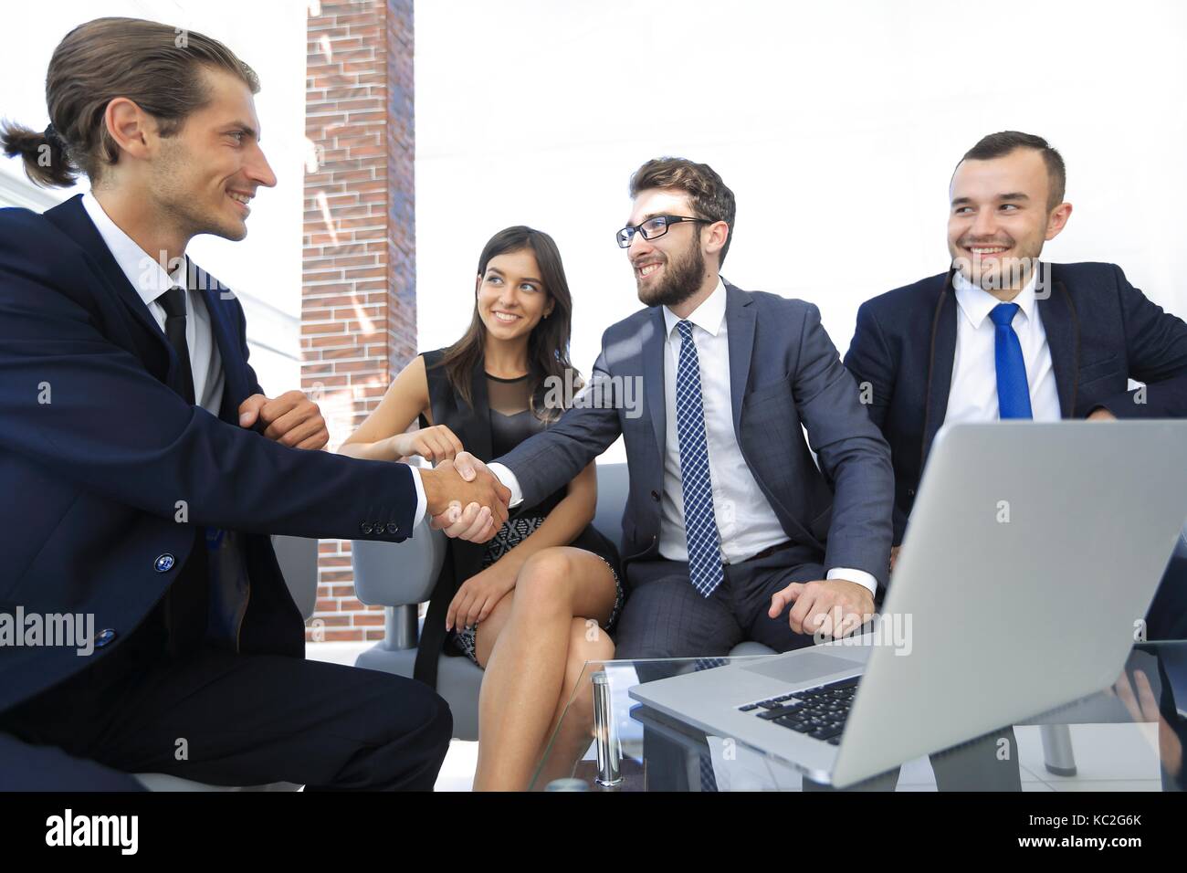 handshake Manager and the client at a meeting in the office lobby.the ...