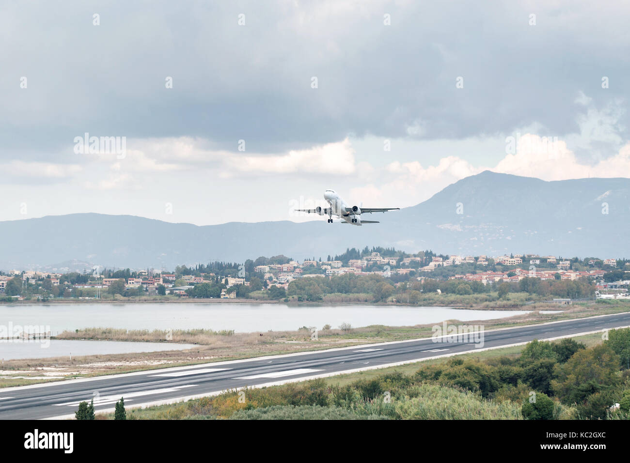 Corfu island, Greece. Modern passenger airplane landing at ...