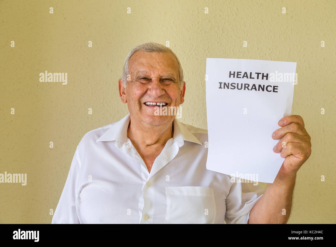 senior showing health insurance document Stock Photo - Alamy