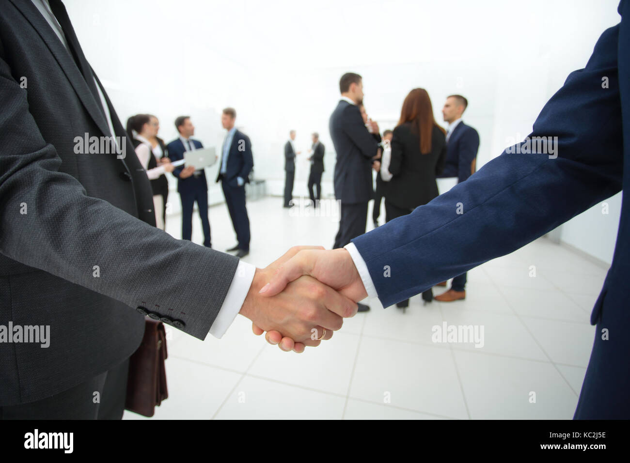 closeup of handshake of business partners on the background of business ...
