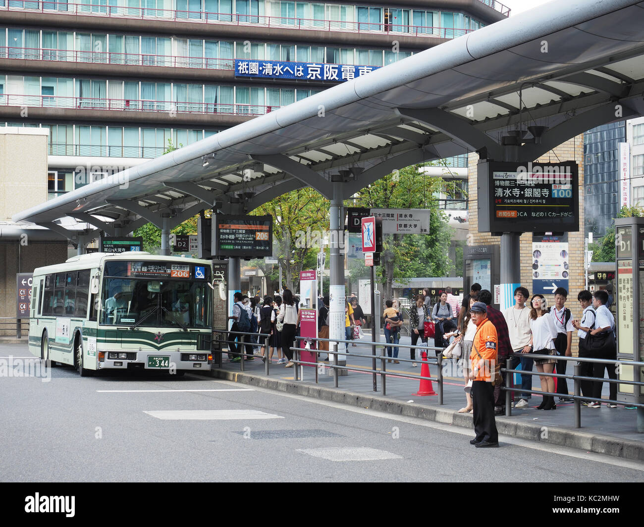 View of a Kyoto Raku tourist Bus 100 parked waiting for passengers at ...