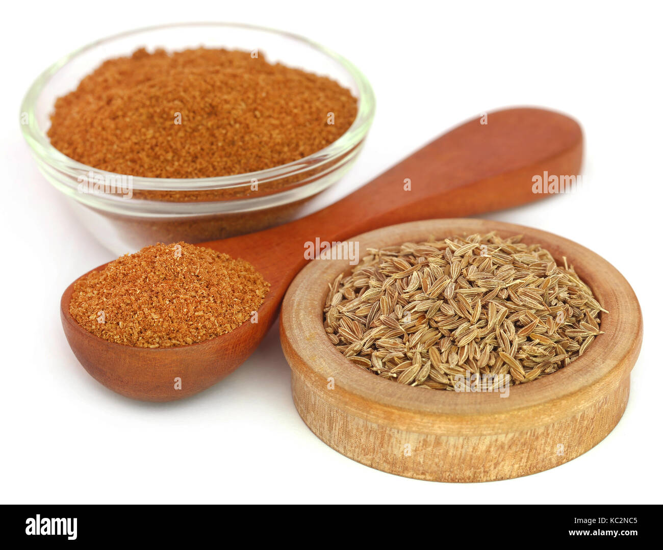 Ground cinnamon with cumin in a spoon over white background Stock Photo ...
