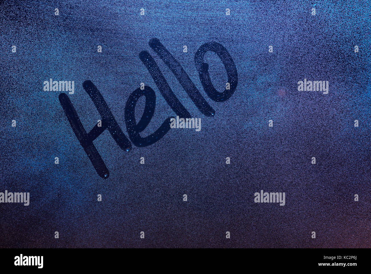 Hello word message draw on fogged window background. Hi word on wet ...