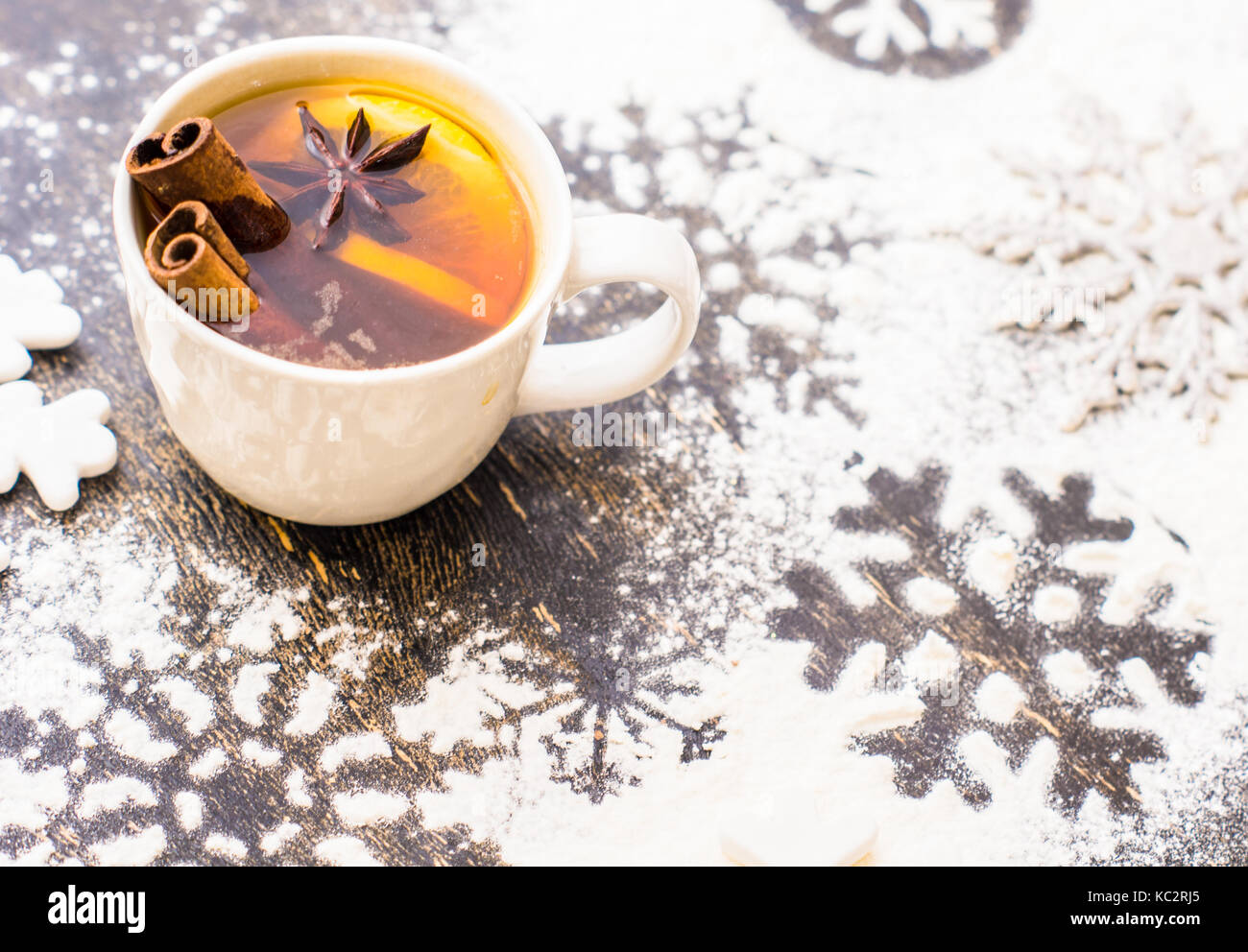 Cup of Tea with a Lemon and Cinnamon on Christmas background with snow ...