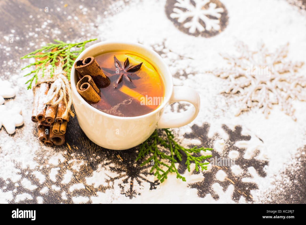 Cup of Tea with a Lemon and Cinnamon on Christmas background with snow ...