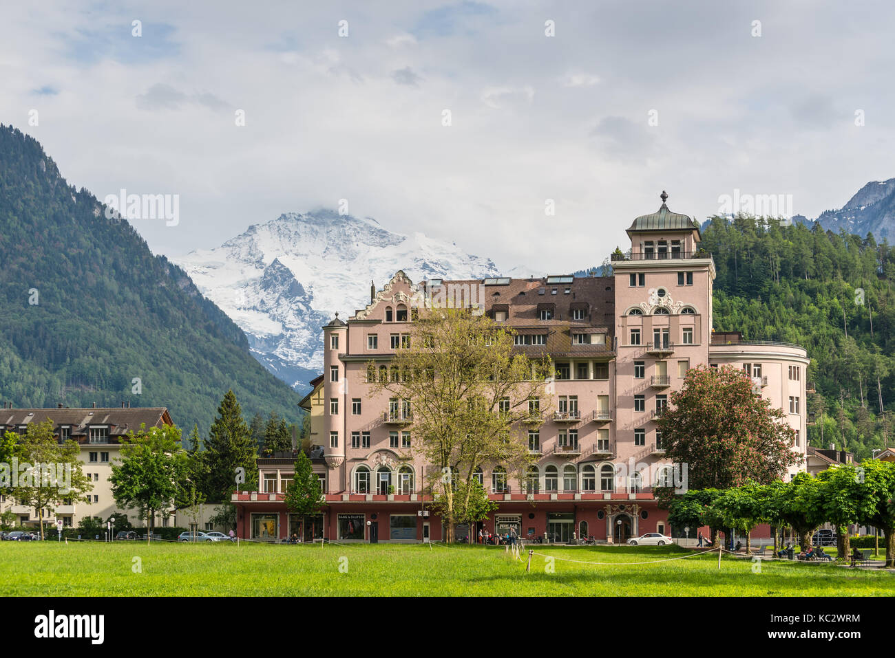 Interlaken, Switzerland - May 26, 2016: Green fields and mountain with ...
