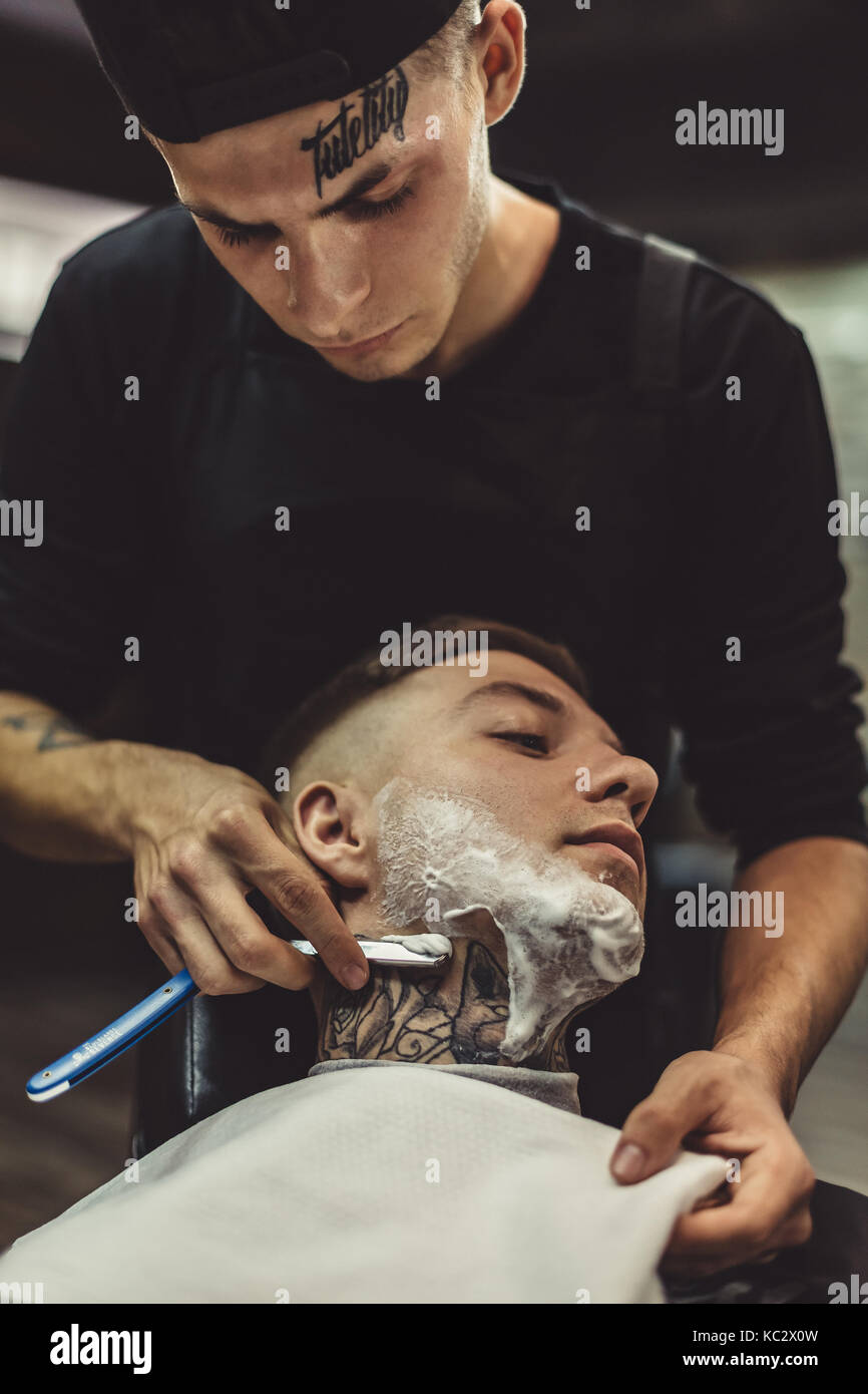 Barber shaving client Stock Photo - Alamy Barber shaving client Stock Photo - Alamy