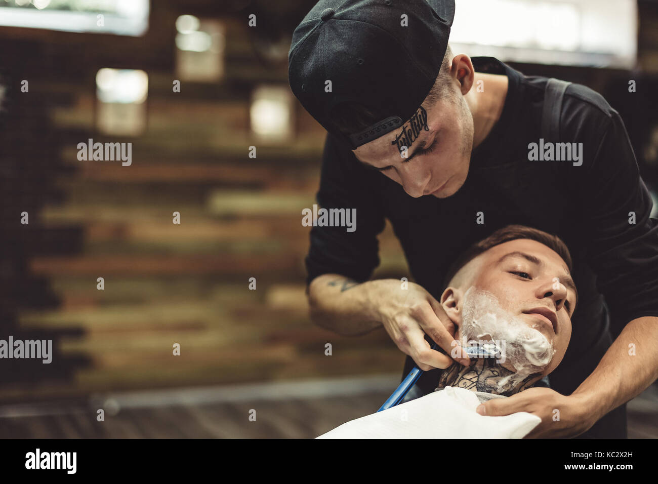 Barber shaving client Stock Photo - Alamy Barber shaving client Stock Photo - Alamy