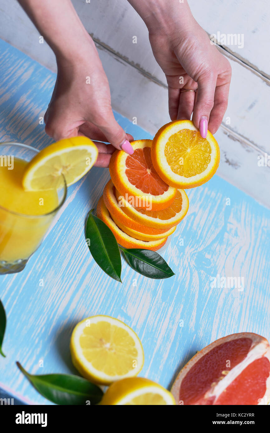 The orange in the hands Stock Photo - Alamy