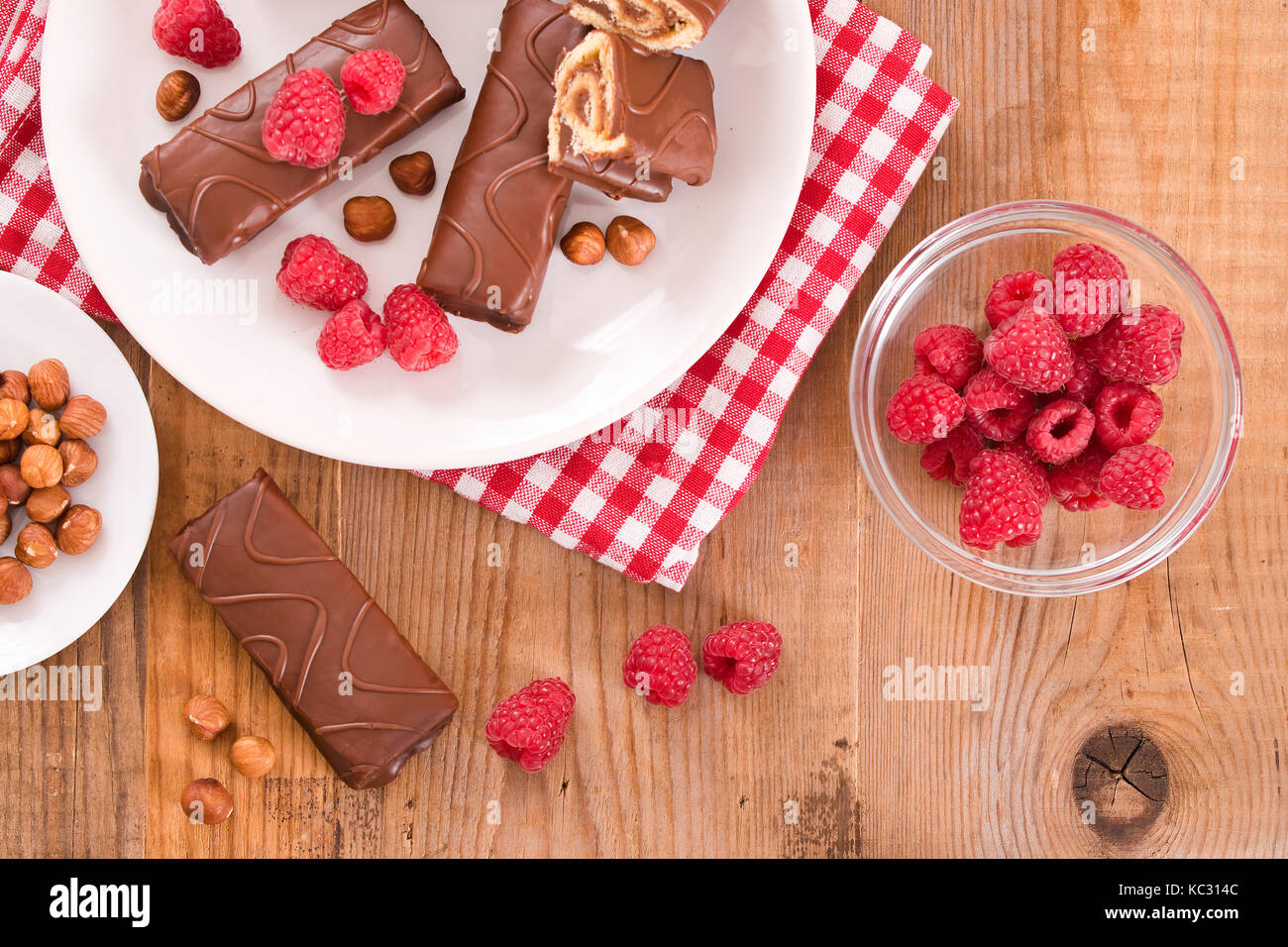 Chocolate rolls with hazelnuts and raspberries Stock Photo - Alamy