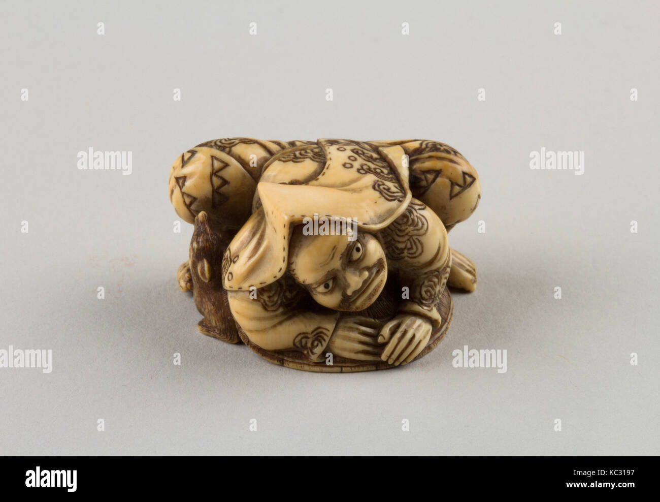 Netsuke of a Hunter Trying to Catch a Fox Beneath a Straw Hat, Shūōsai ...