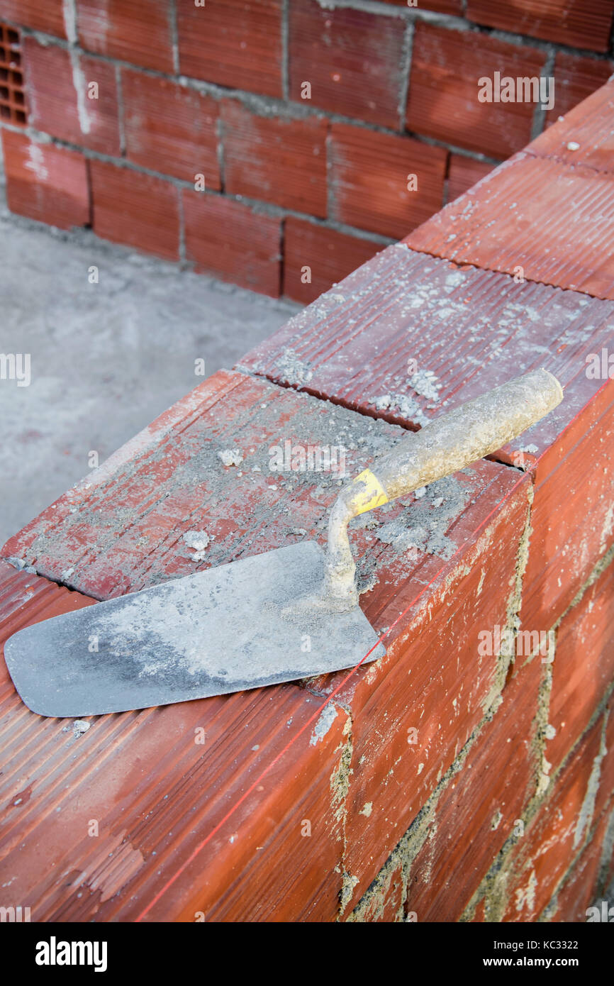 Red brick wall in construction Stock Photo - Alamy