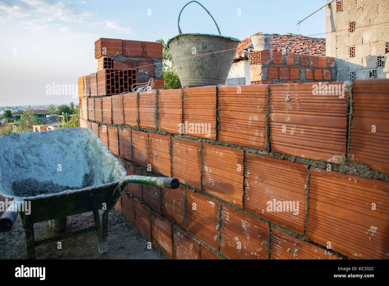 Red brick wall in construction Stock Photo - Alamy