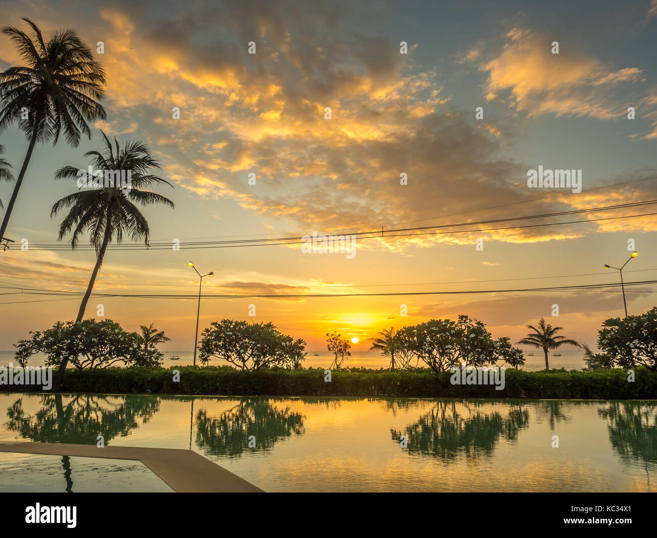 Twilight sunrise sky in morning at sea, view from swimming pool, with ...