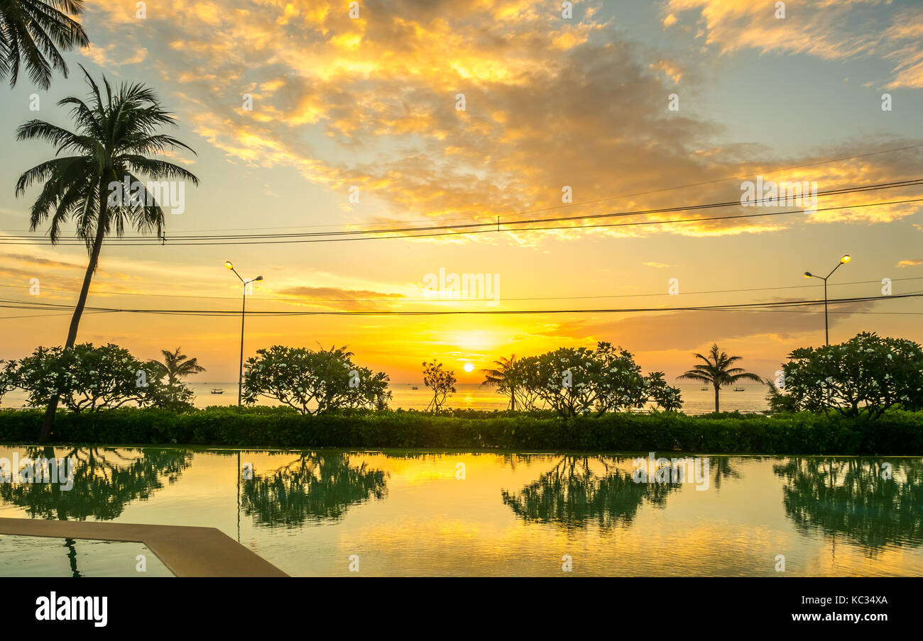 Twilight sunrise sky in morning at sea, view from swimming pool, with ...