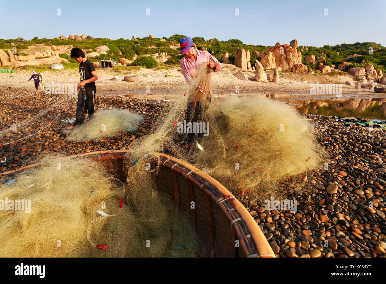 Fishermen collect fish at Co Thach beach in early morning, Binh Thuan ...