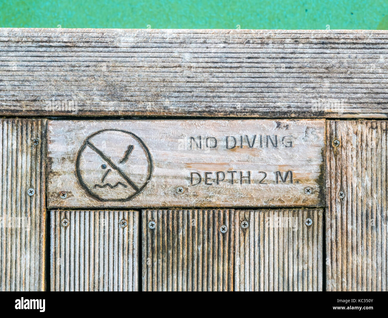No diving warn sign and two meters depth at side of swimming pool Stock ...