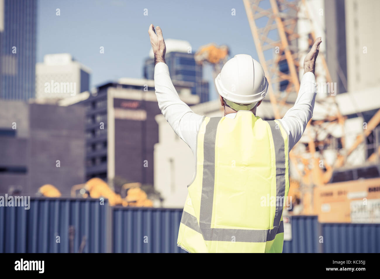 Senior foreman in glasses doing his job at building area on sunn Stock ...