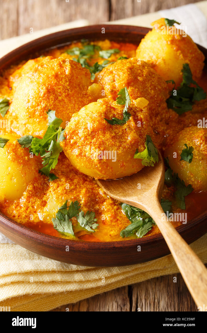Spicy potato Dum aloo in curry sauce close-up in a bowl. verical Stock ...
