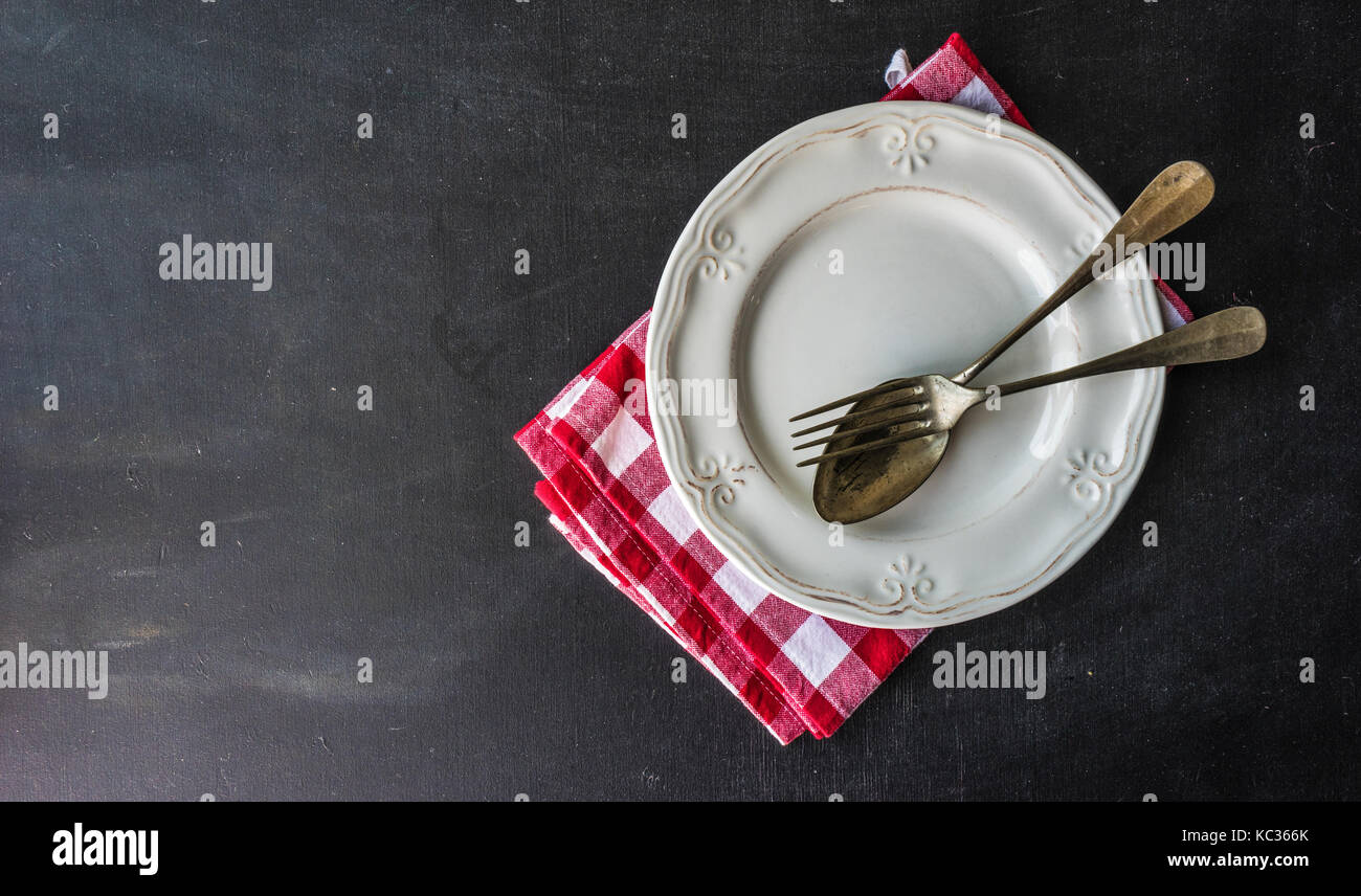Rustic table setting with vintage flatware onn dark wooden table Stock ...