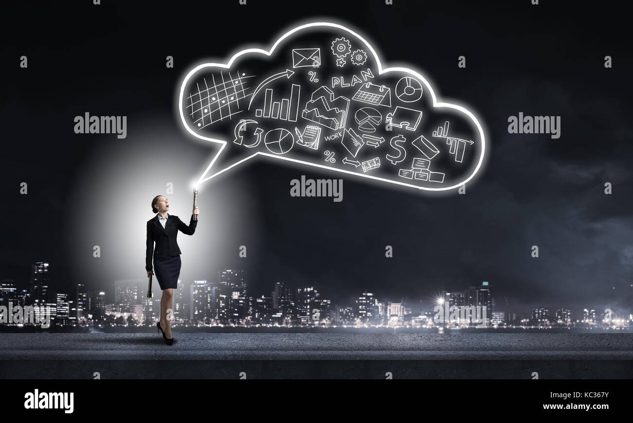 Woman throwing light on her ideas Stock Photo - Alamy