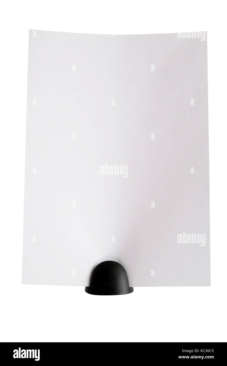 Sheet of paper on a black support, isolated on white background by ...