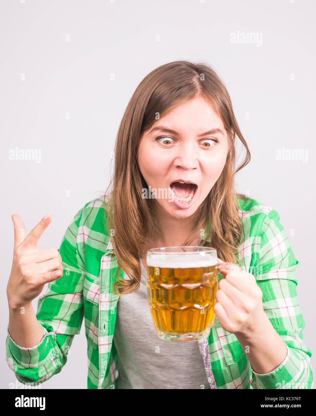 Emotional fans with a beer at a bar Stock Photo - Alamy