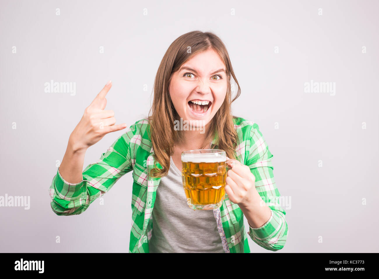 Emotional fans with a beer at a bar Stock Photo - Alamy