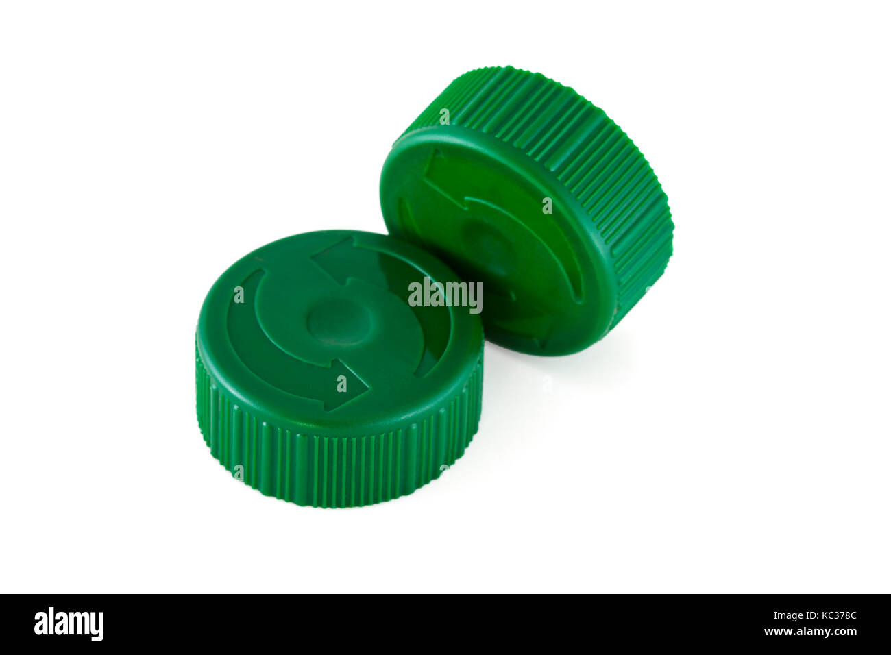 Two green plastic bottle caps isolated on white Stock Photo - Alamy