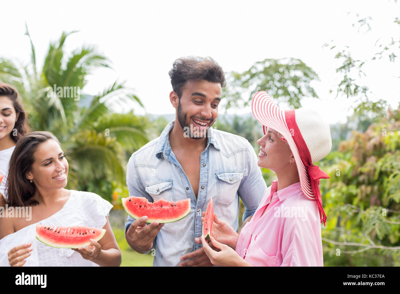 Cheerful Young Group Of Friends Having Fun Together Eating Watermelon ...