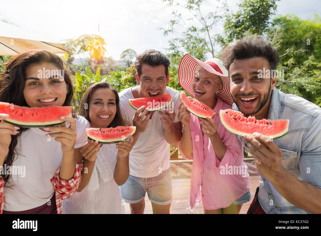 Cheerful Group Of Friends With Watermelon Slice Smile Together Eating ...