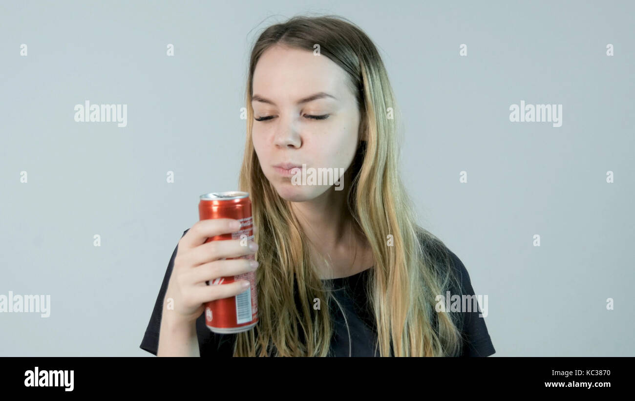 Young woman drinking a soda.Young beautiful woman drinking soda and ...