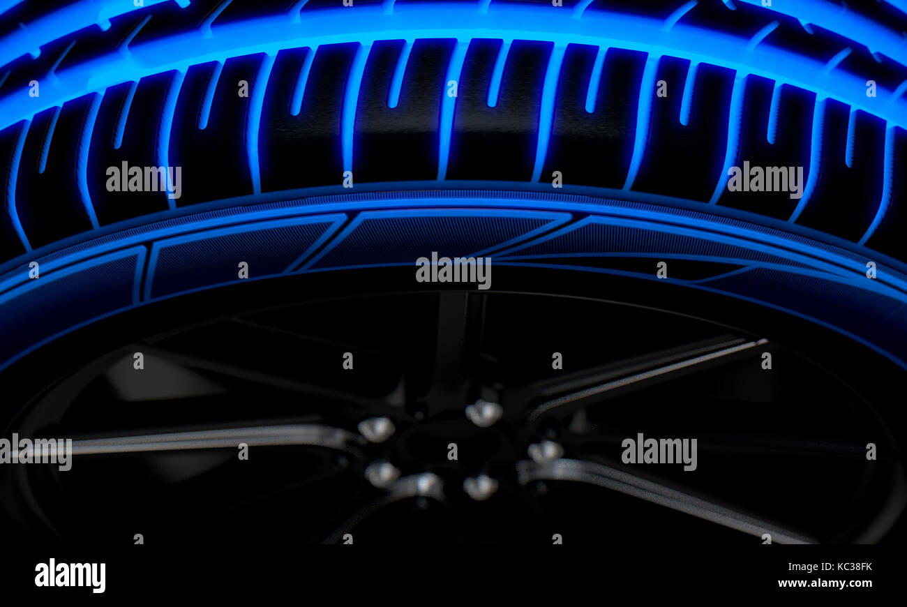 A modern sporty low profile tire with blue futuristic glowing patterns ...