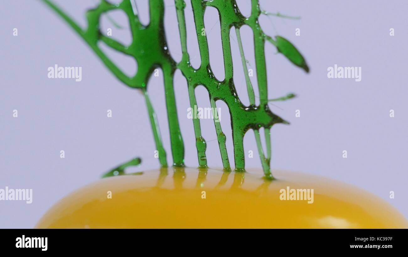 Modern mousse cakes with caramel glaze decorated for kids party. Yellow ...