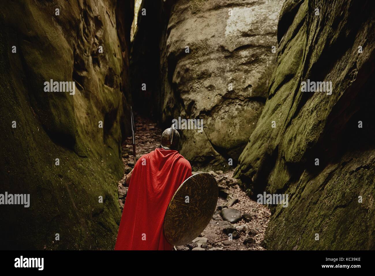 Warrior exploring place in rocks Stock Photo - Alamy