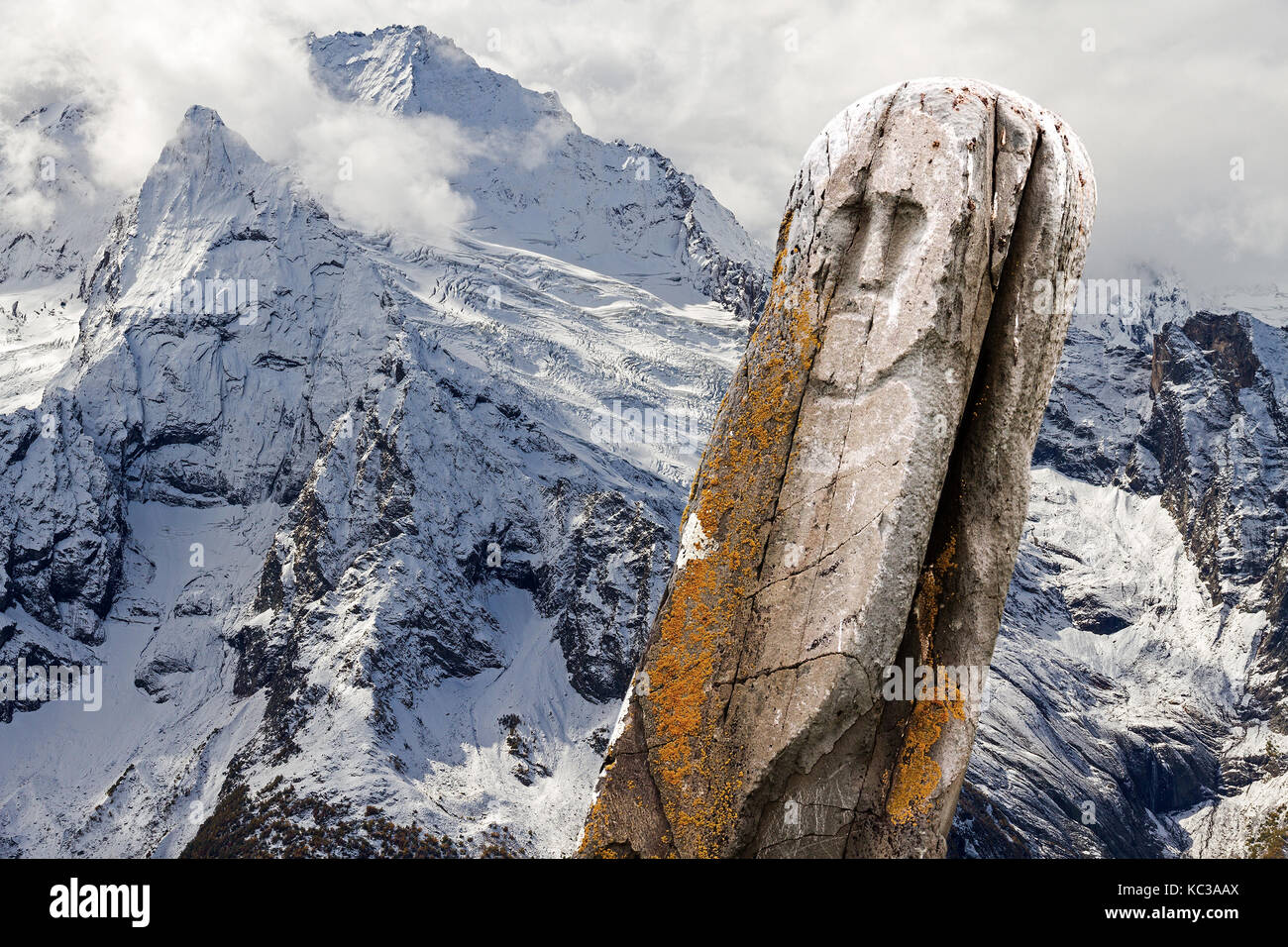 Ancient stone tribal ritual totem (idol) with a winter mountain ...