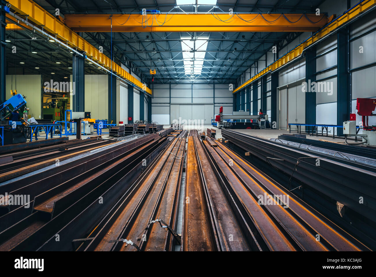 Industrial hall with cutting, welding machines and metal profiles Stock ...