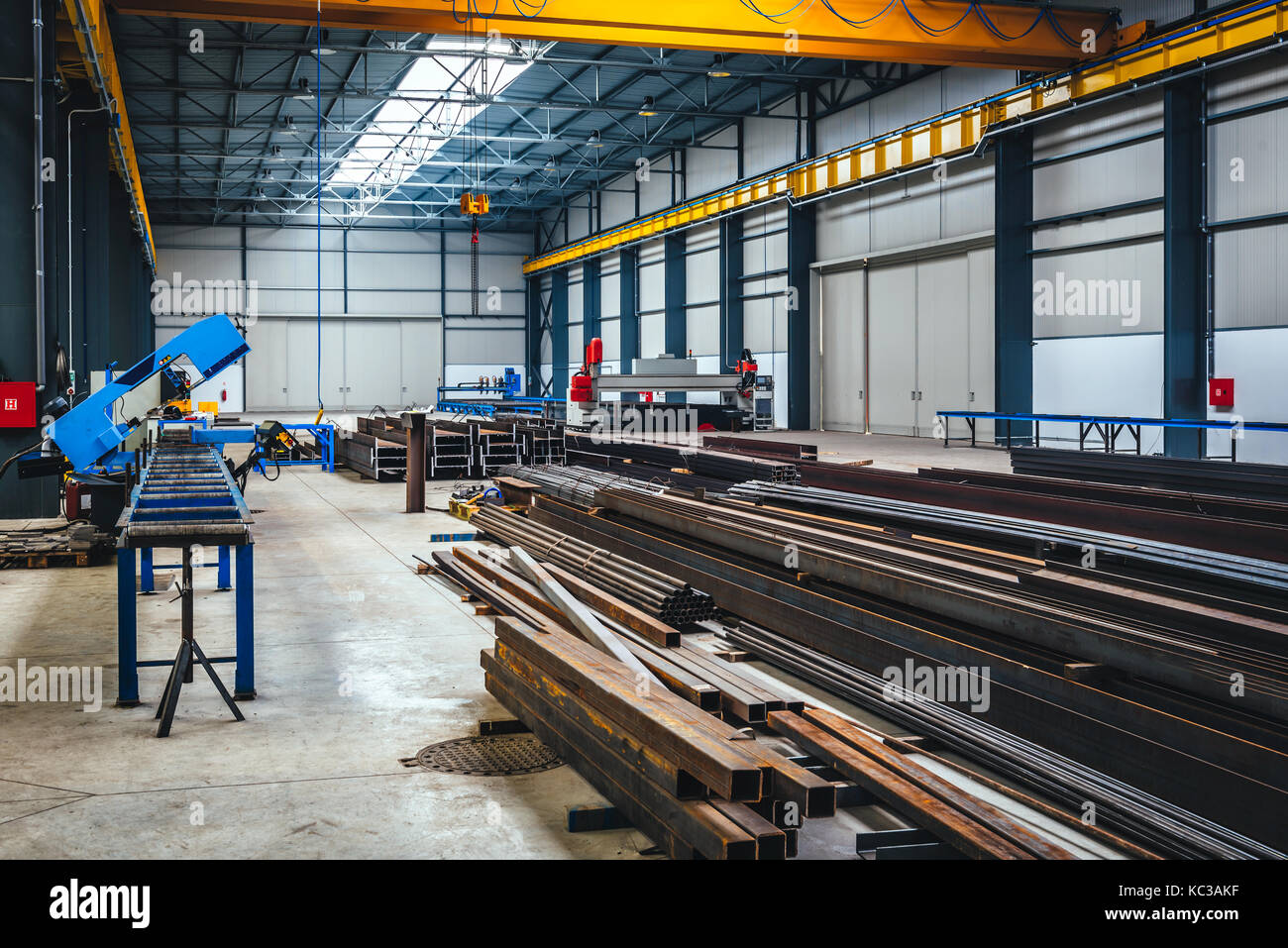 Industrial hall with cutting, welding machines and metal profiles Stock ...