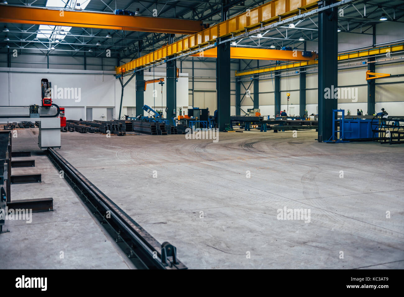 Big industrial hall with various machines and metal profiles Stock ...