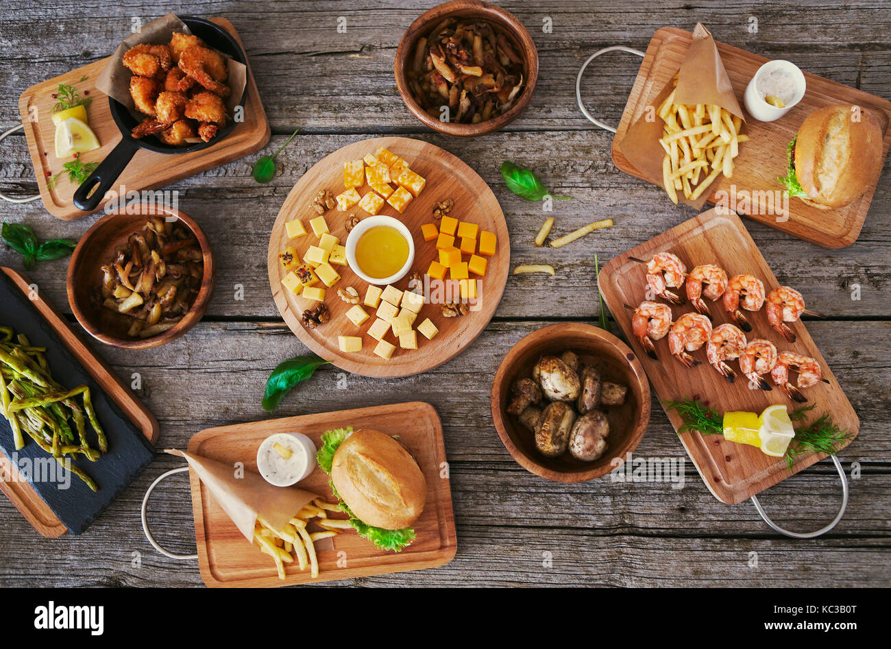 Top view of rustick wooden table with food and snack Stock Photo - Alamy