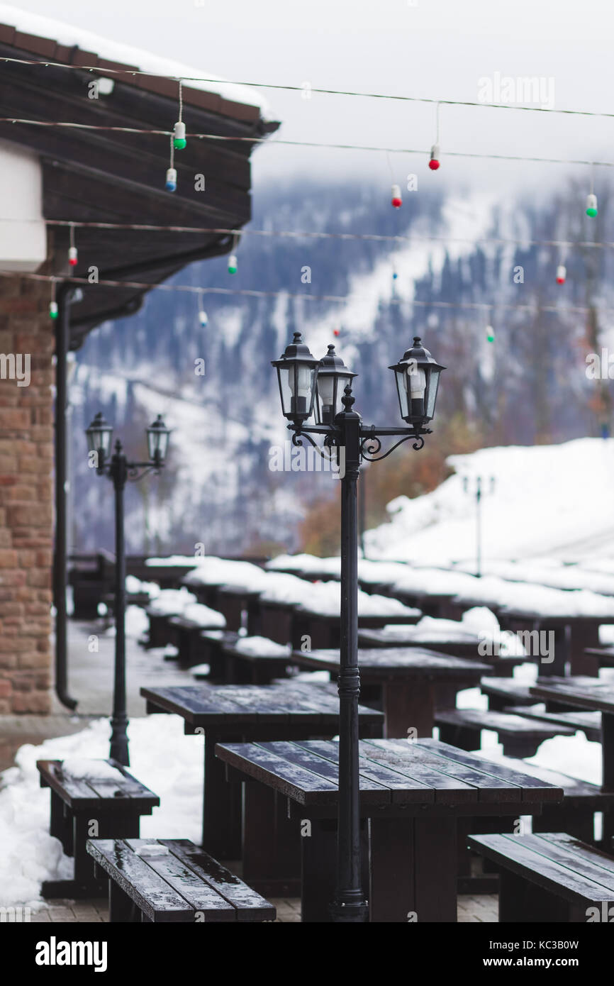 Сafe tables outdoor covered with snow in winter Stock Photo - Alamy