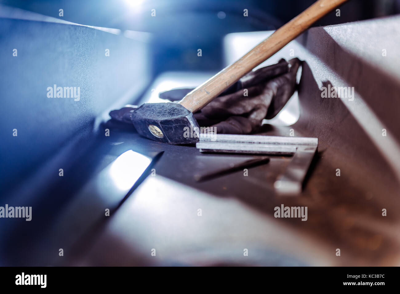 Industrial tool in big metal profile background Stock Photo - Alamy