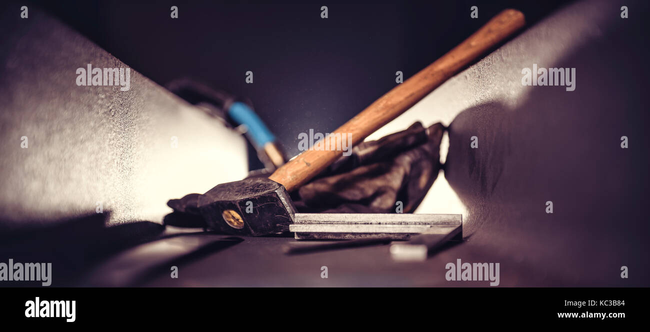 Industrial tool in big metal profile background Stock Photo - Alamy