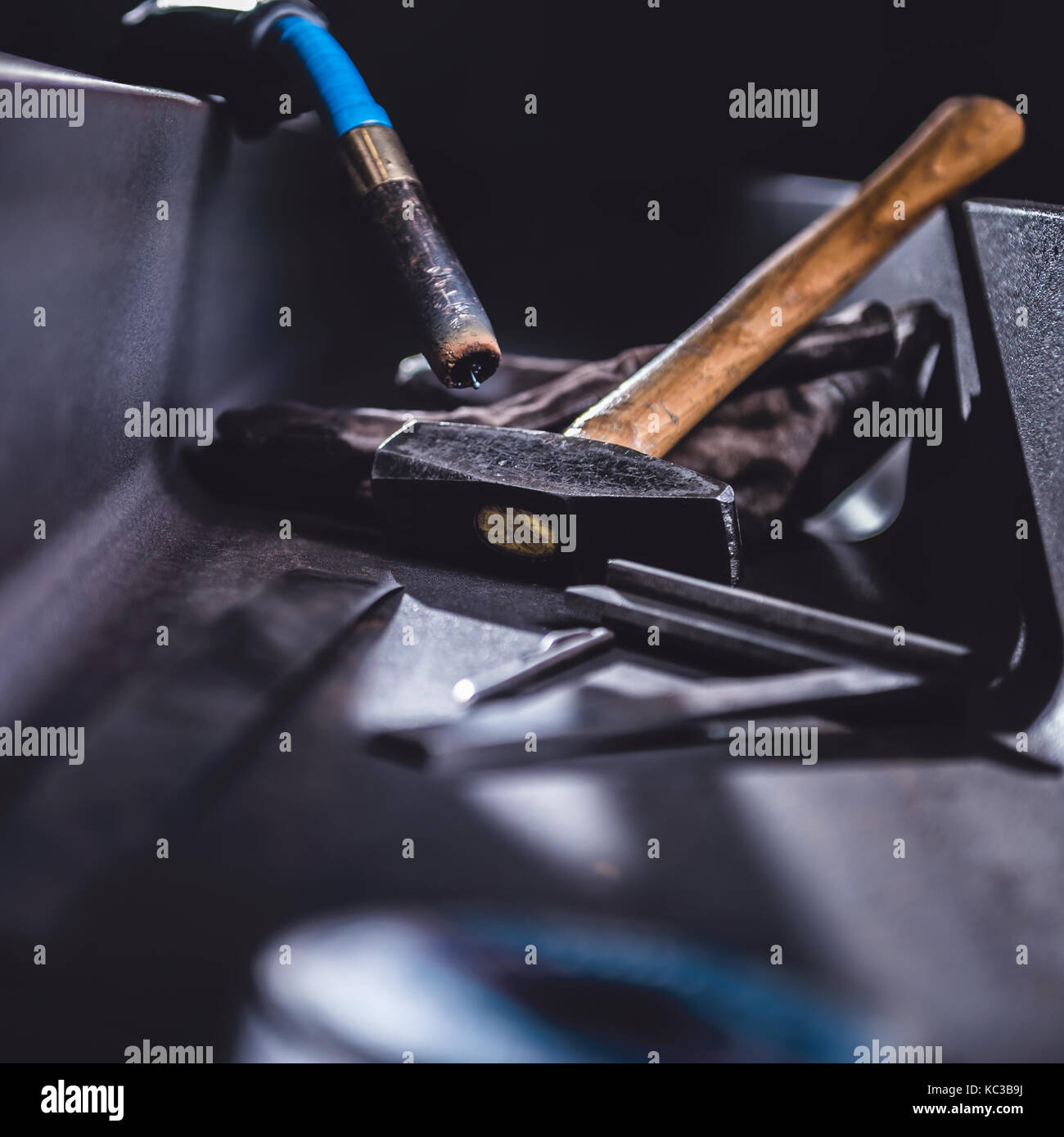 Industrial welding tool in big metal profile background Stock Photo - Alamy